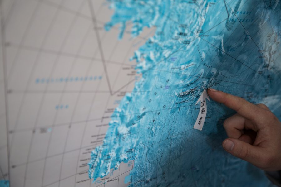 Finger points to the location of Union Glacier, on a map of Antarctica ...